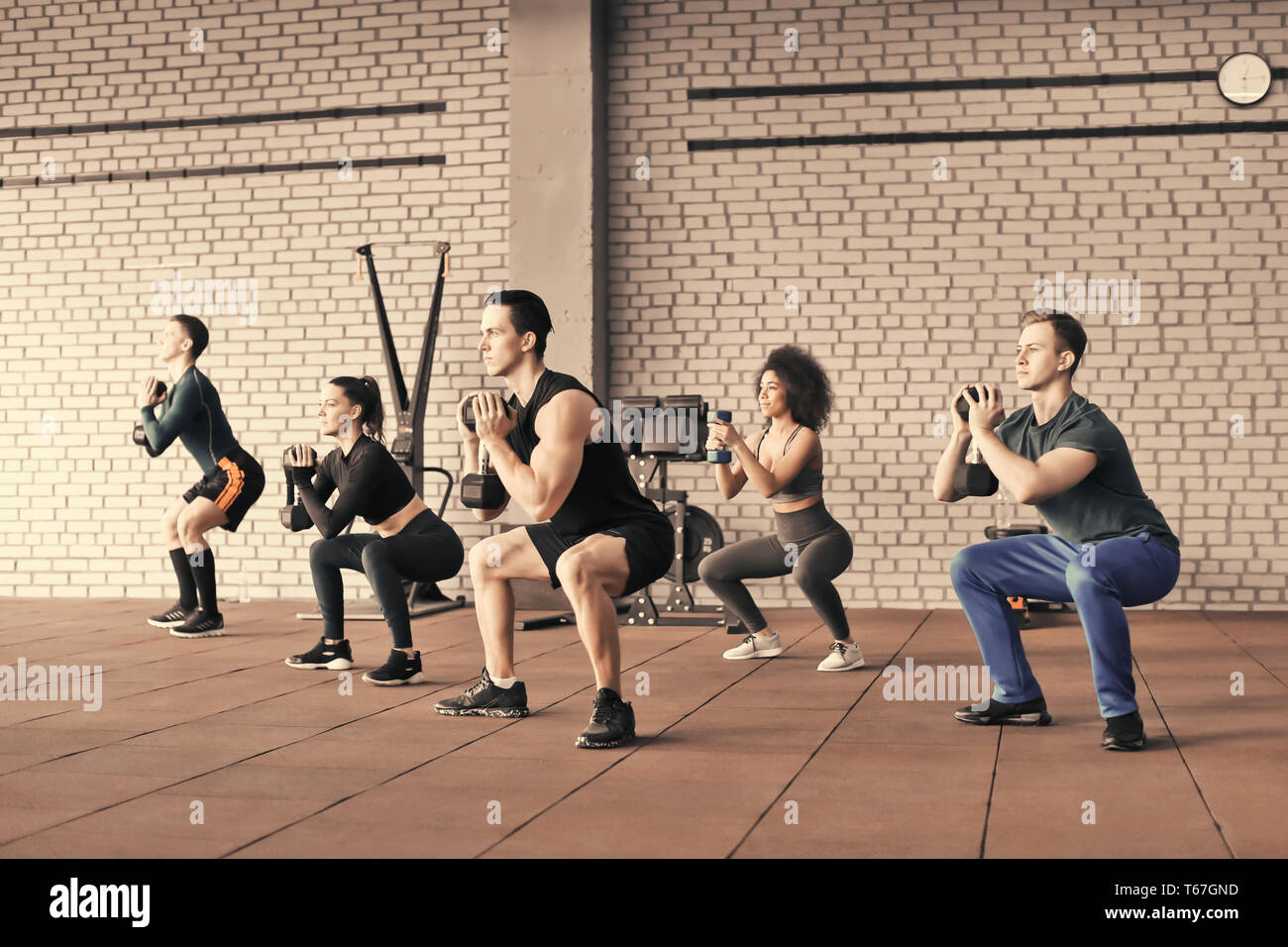 Group of athletes working out in gym Stock Photo - Alamy