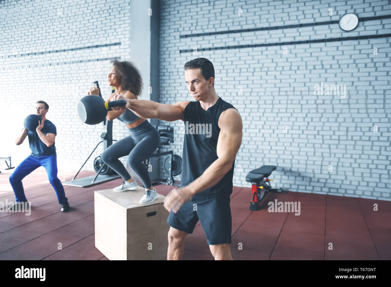 Group of athletes working out in gym Stock Photo - Alamy
