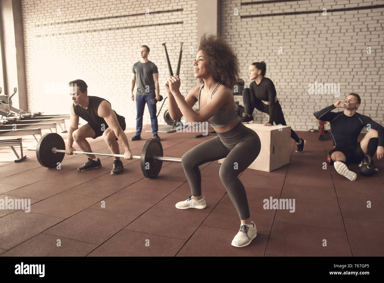 Group of athletes working out in gym Stock Photo - Alamy