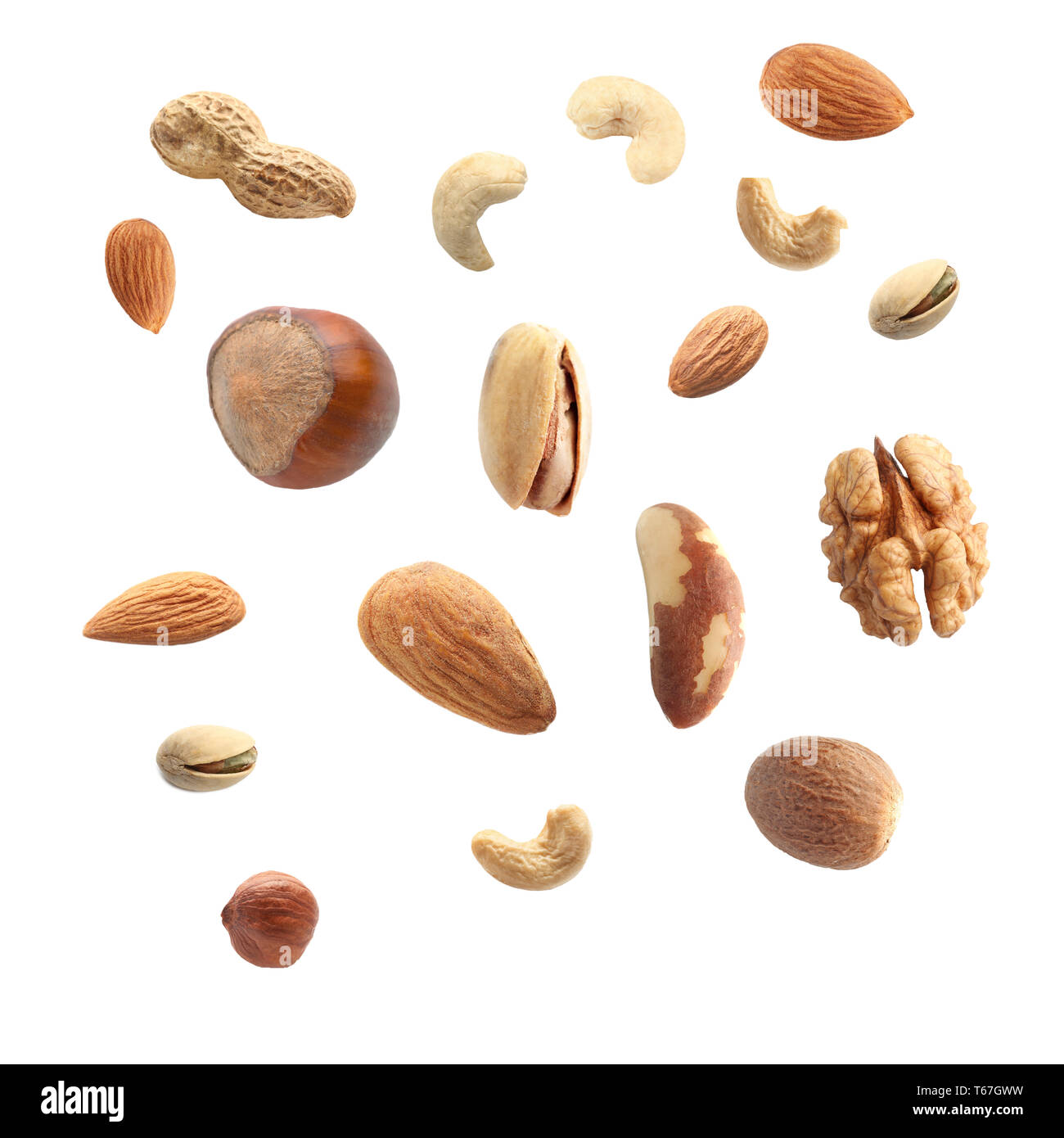 Falling nuts on white background Stock Photo - Alamy