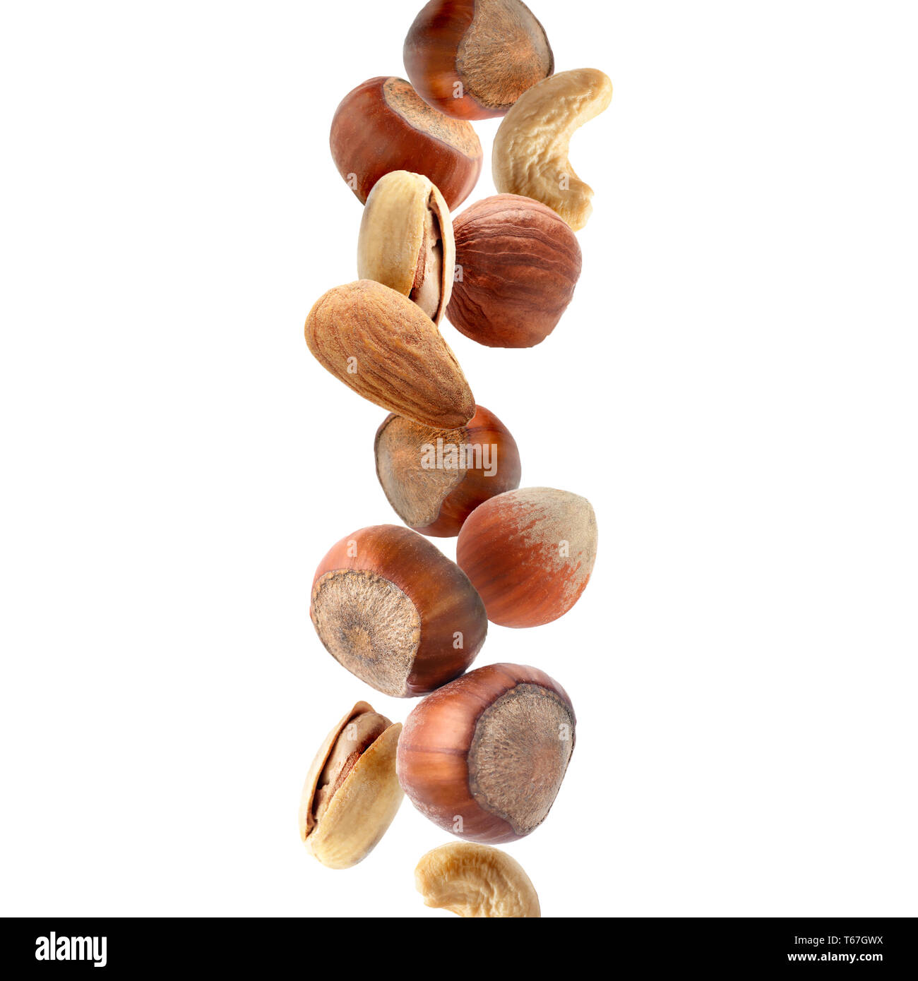 Falling nuts on white background Stock Photo - Alamy
