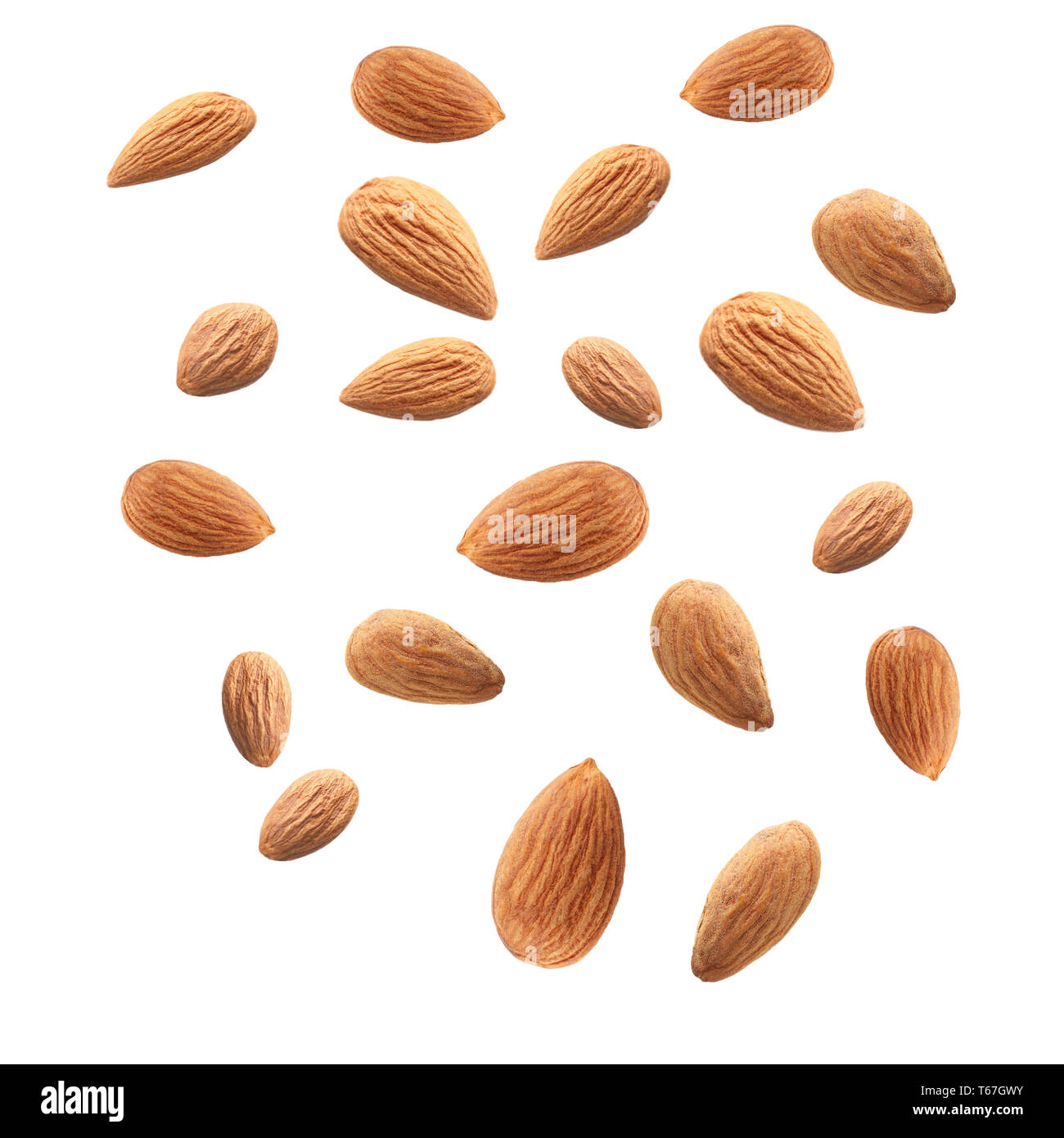 Falling almond nuts on white background Stock Photo - Alamy
