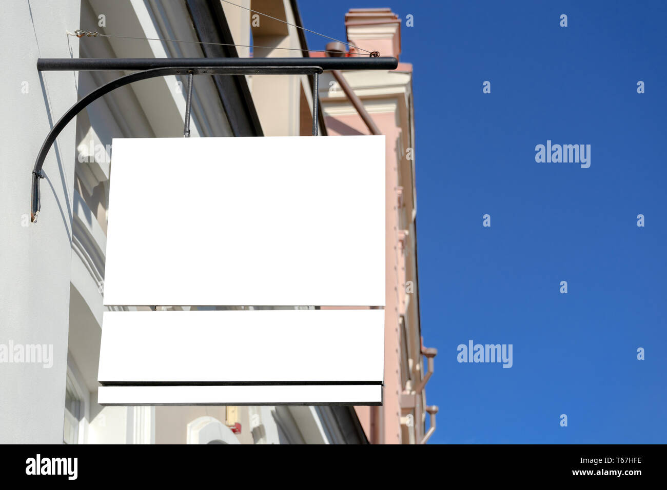 Mock up. Blank rectangular shape signboard on the wall of classical ...