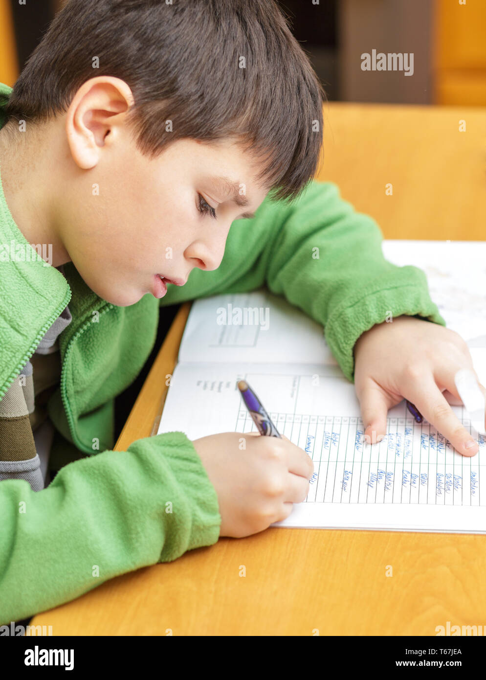 bored and tired boy doing homework Stock Photo - Alamy