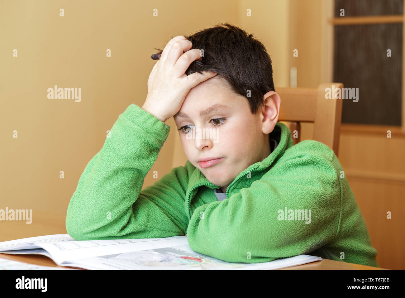 bored and tired boy doing homework Stock Photo - Alamy