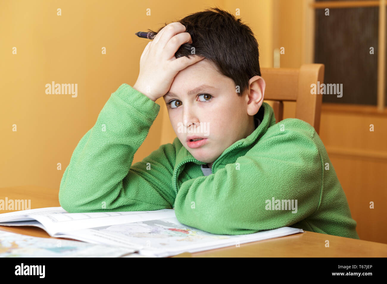 bored and tired boy doing homework Stock Photo - Alamy