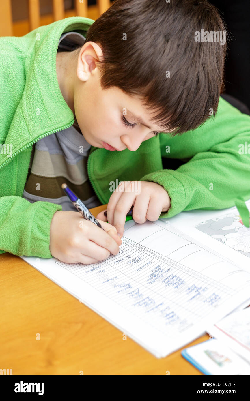 bored and tired boy doing homework Stock Photo - Alamy