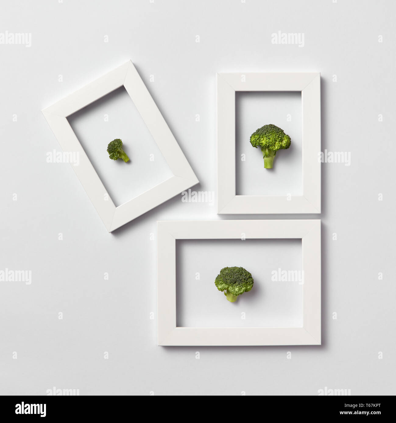 Organic frames with fresh natural broccoli on a light background Stock Photo - Alamy