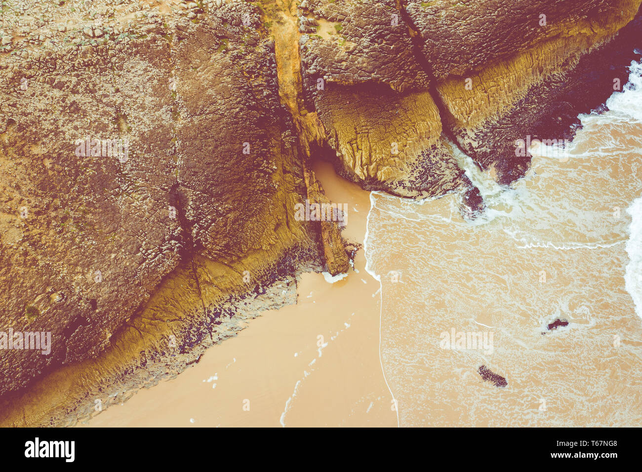 Aerial view to ocean waves. Yellow sand beach. Blue water background ...