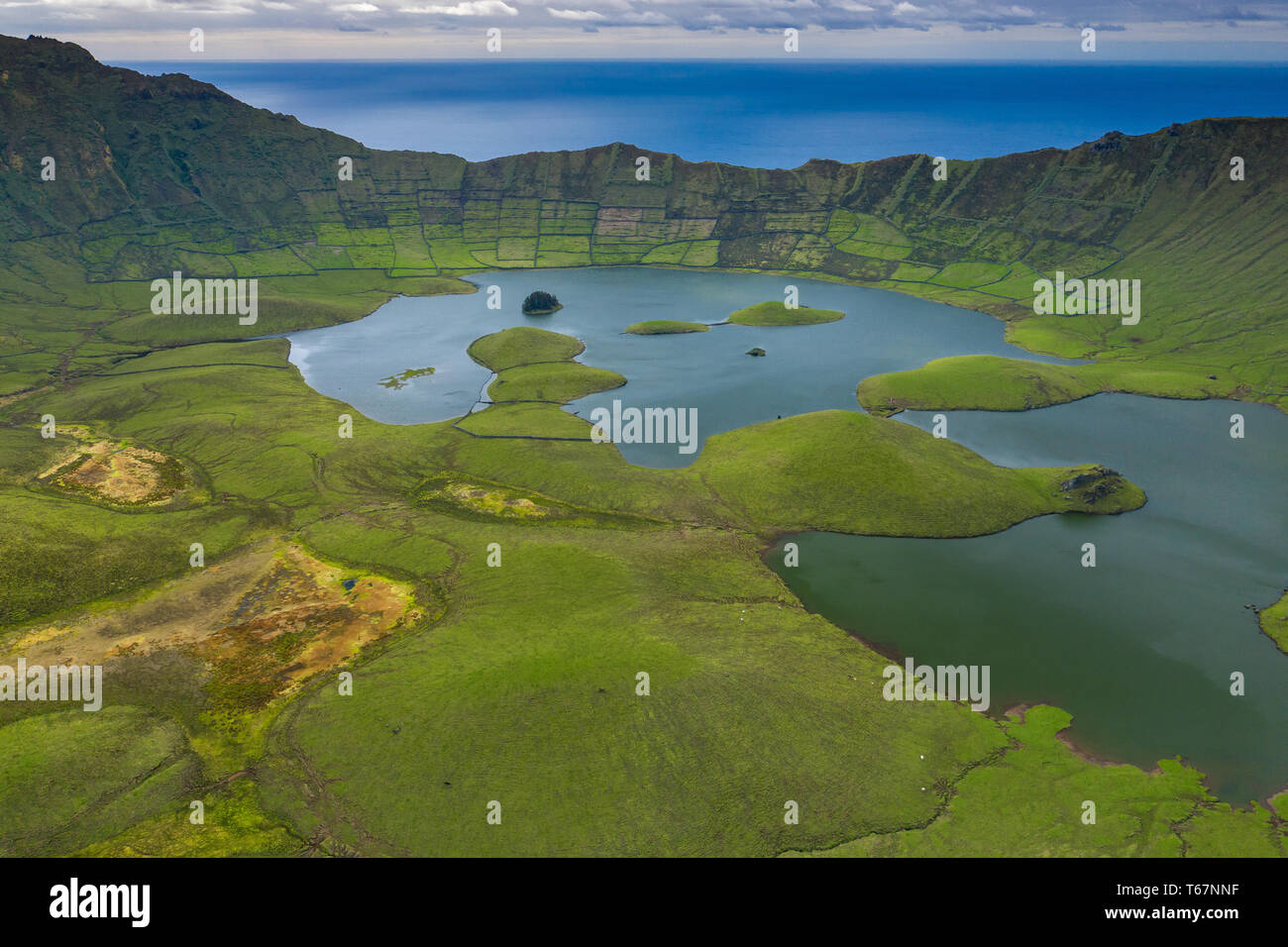 Aerial view of volcanic crater (Caldeirao) with a beautiful lake on the ...