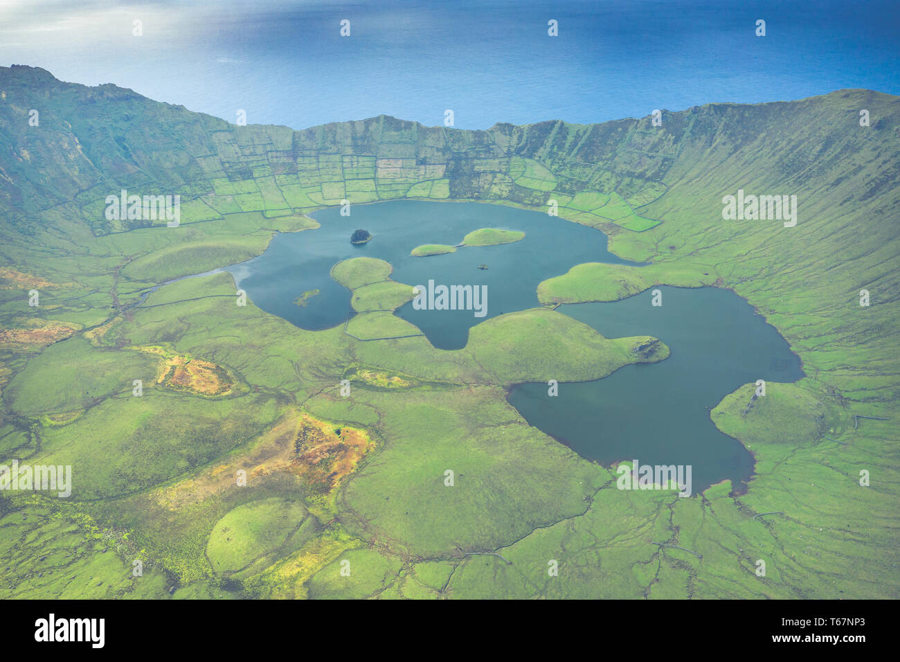 Aerial view of volcanic crater (Caldeirao) with a beautiful lake on the ...
