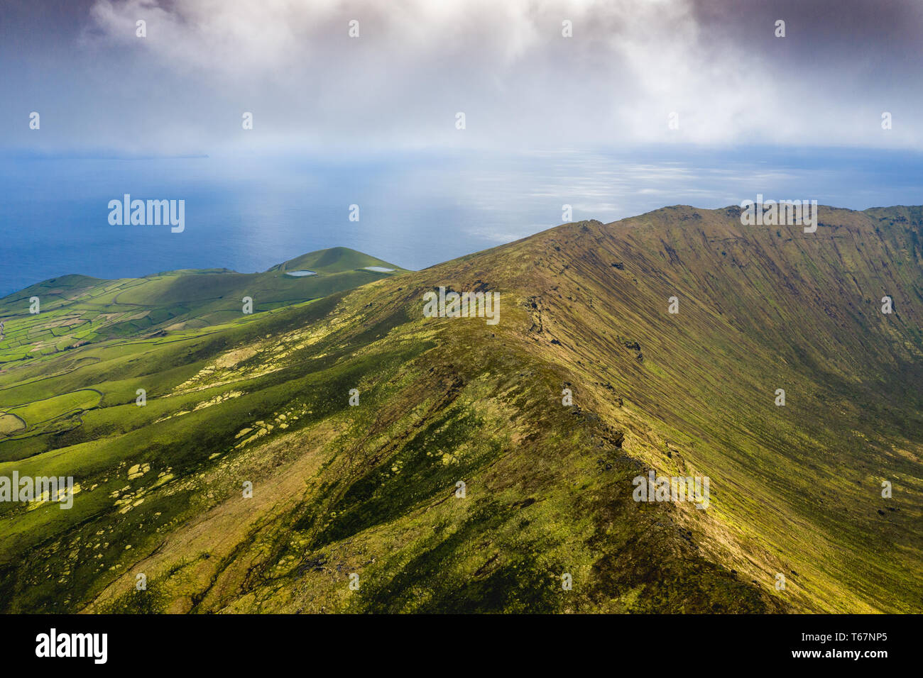 Aerial view of volcanic crater (Caldeirao) with a beautiful lake on the ...