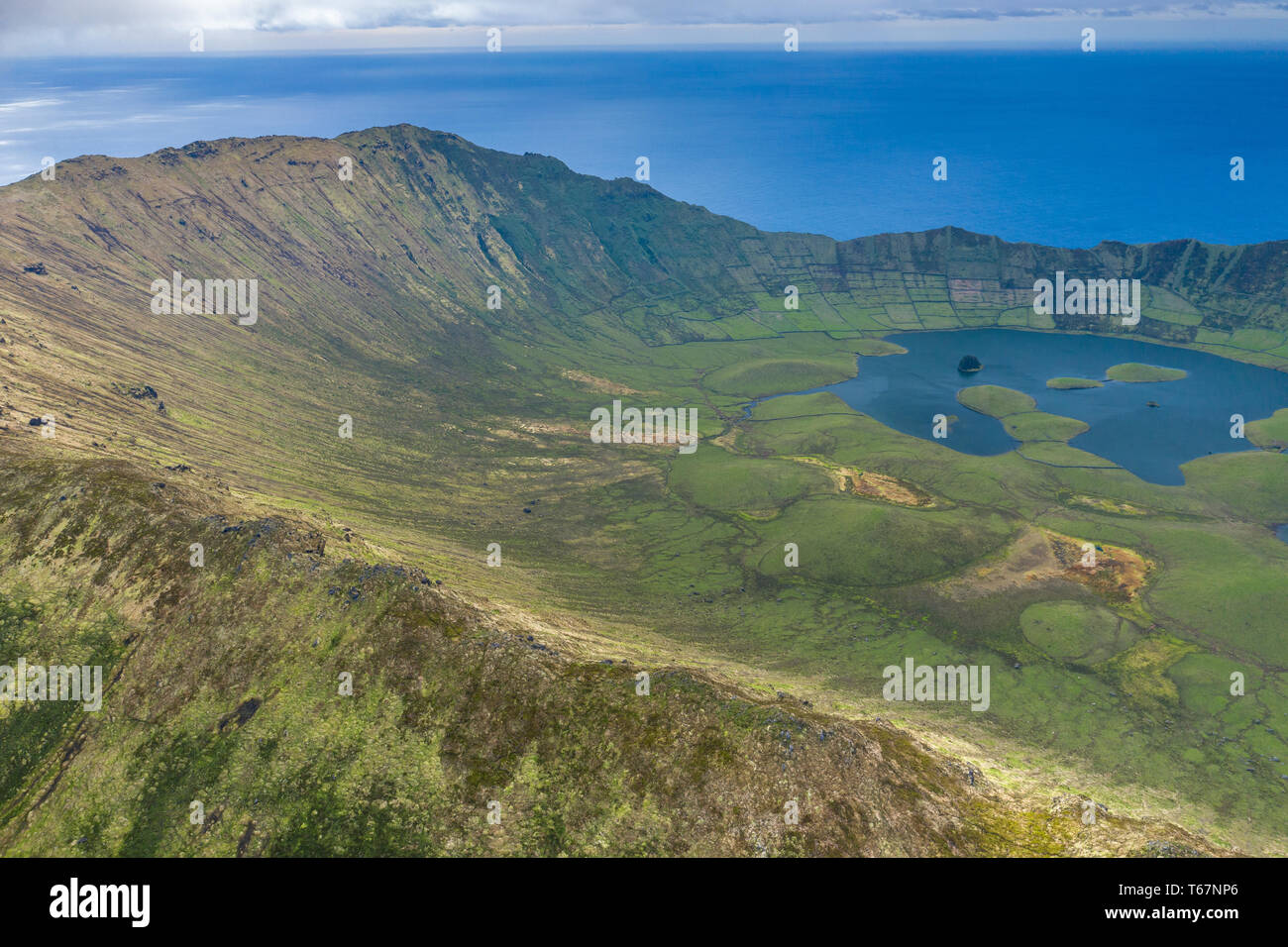 Aerial view of volcanic crater (Caldeirao) with a beautiful lake on the ...