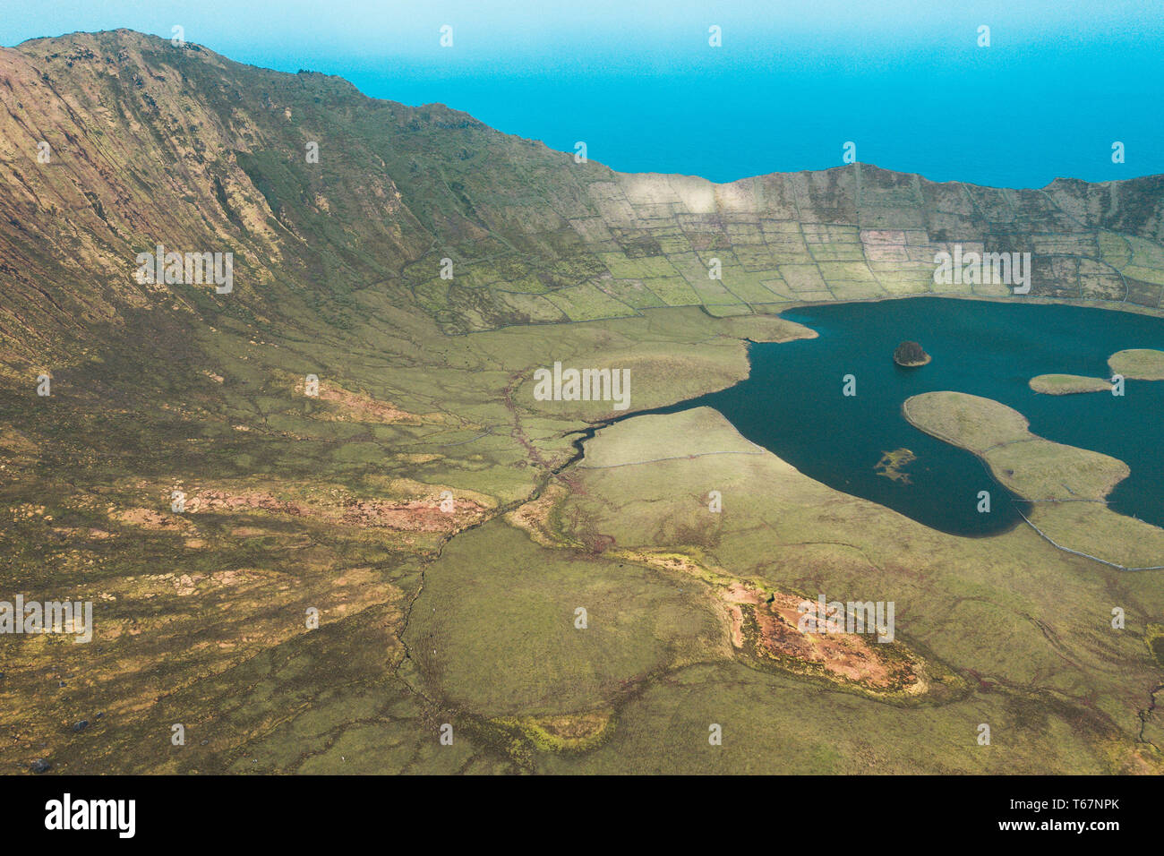 Aerial view of volcanic crater (Caldeirao) with a beautiful lake on the ...