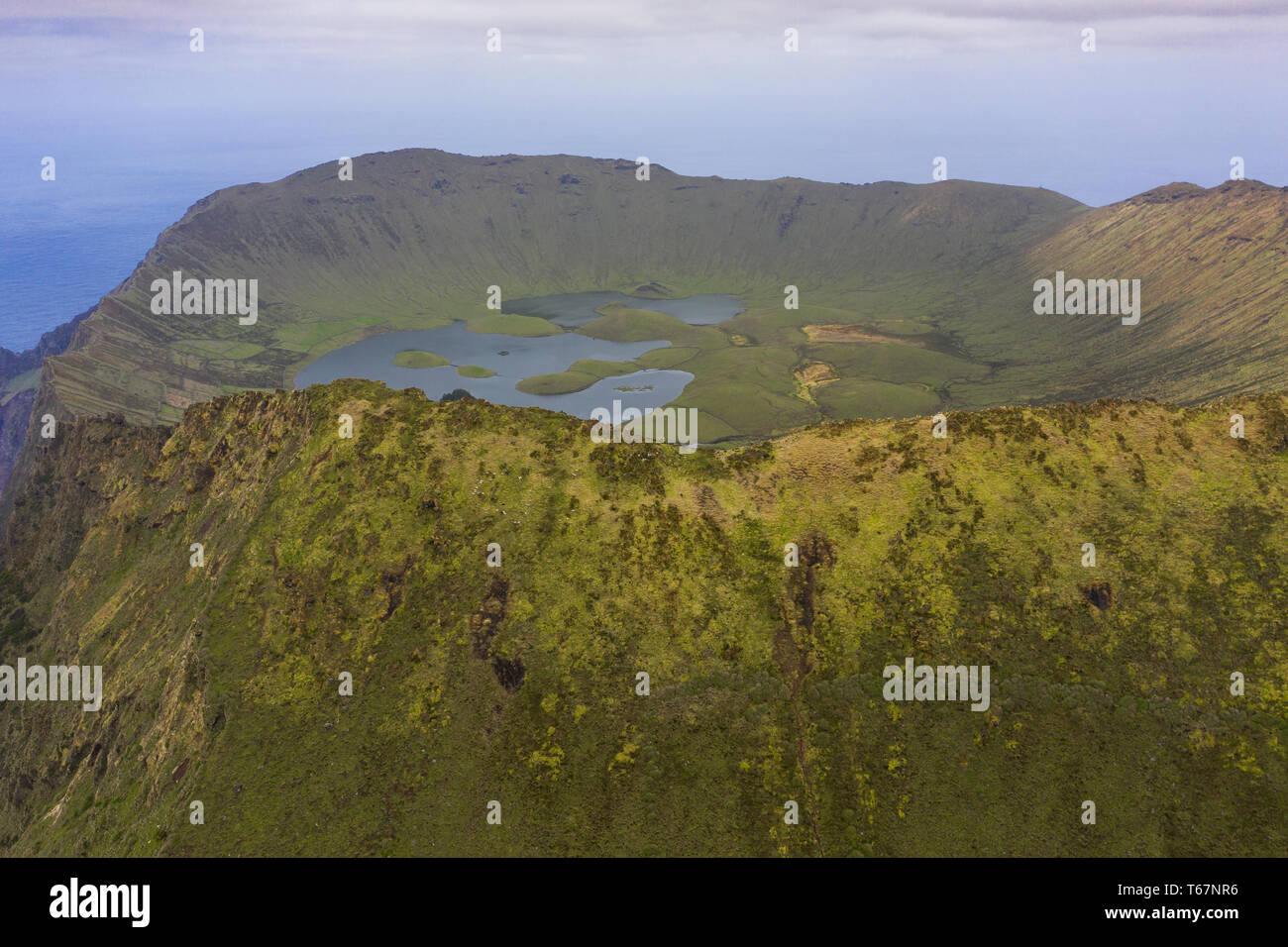 Aerial view of volcanic crater (Caldeirao) with a beautiful lake on the ...