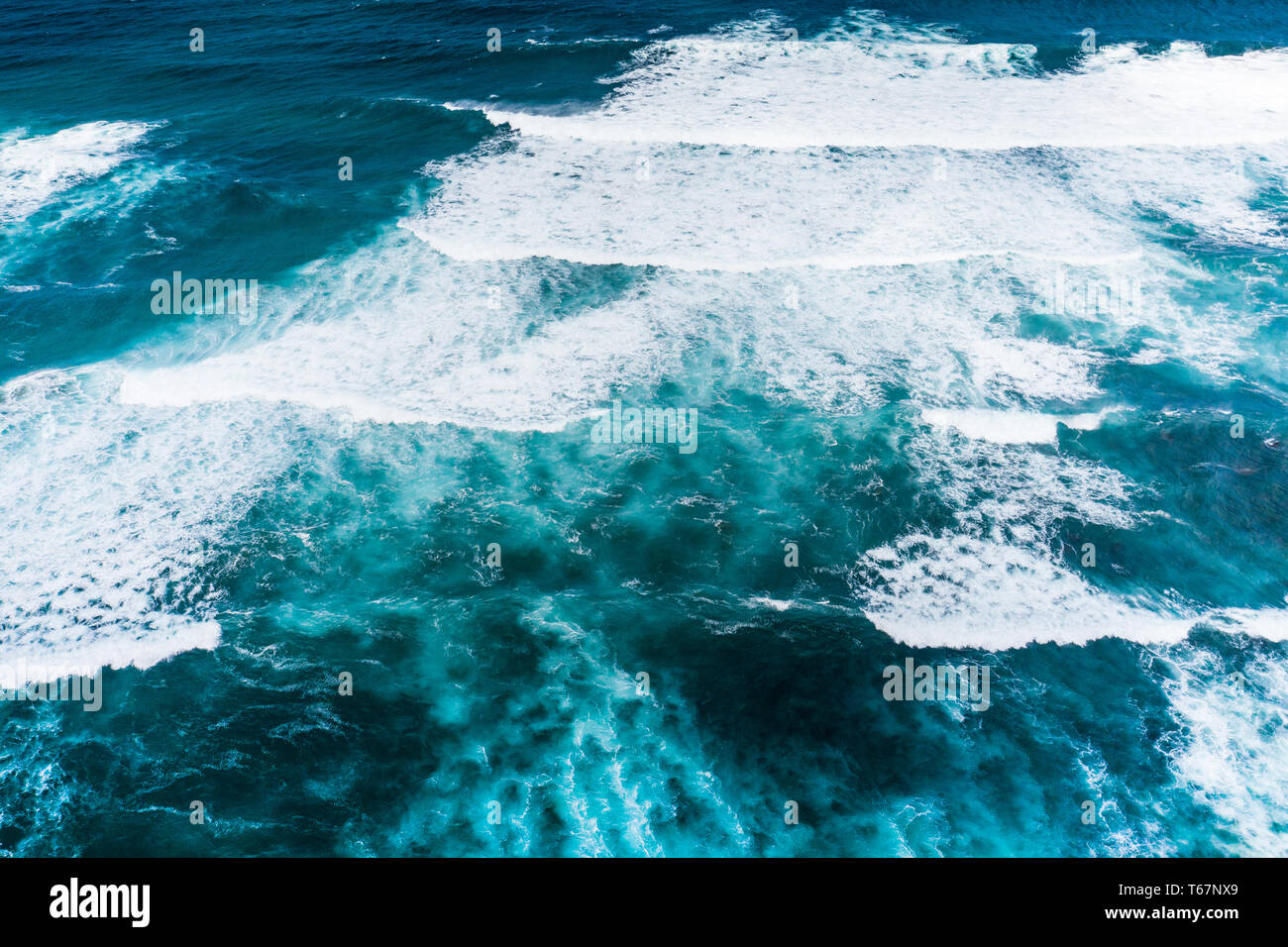 Aerial view to ocean waves. Blue water background. Photo made from ...