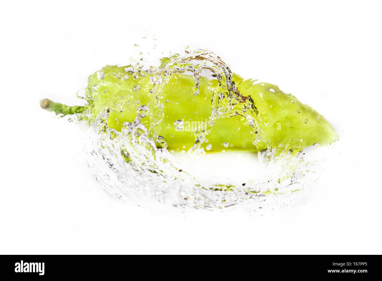 green pepper with water splash isolated Stock Photo - Alamy