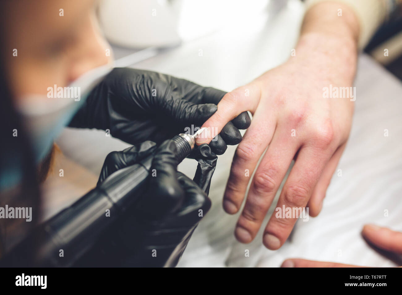 Men's manicure. Professional manicure for man by manicure machine. A ...