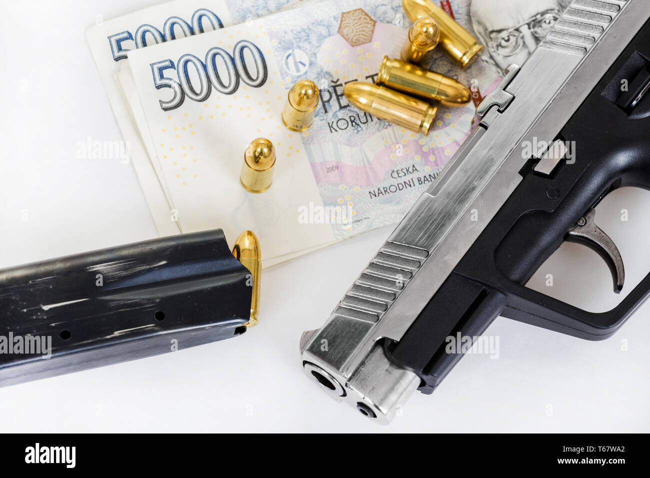 gun with bullet on czech banknotes Stock Photo - Alamy