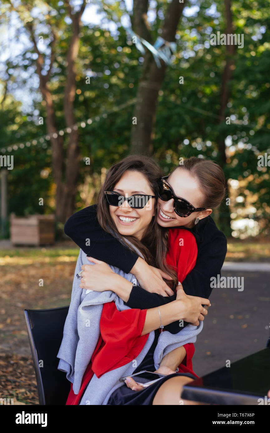 Girl hugging her friend. Portrait Two girlfriends in the park Stock ...