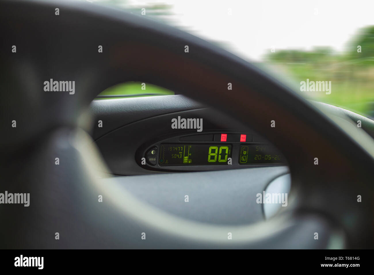 Car dashboard steering wheel and speedometer show speed Stock Photo - Alamy