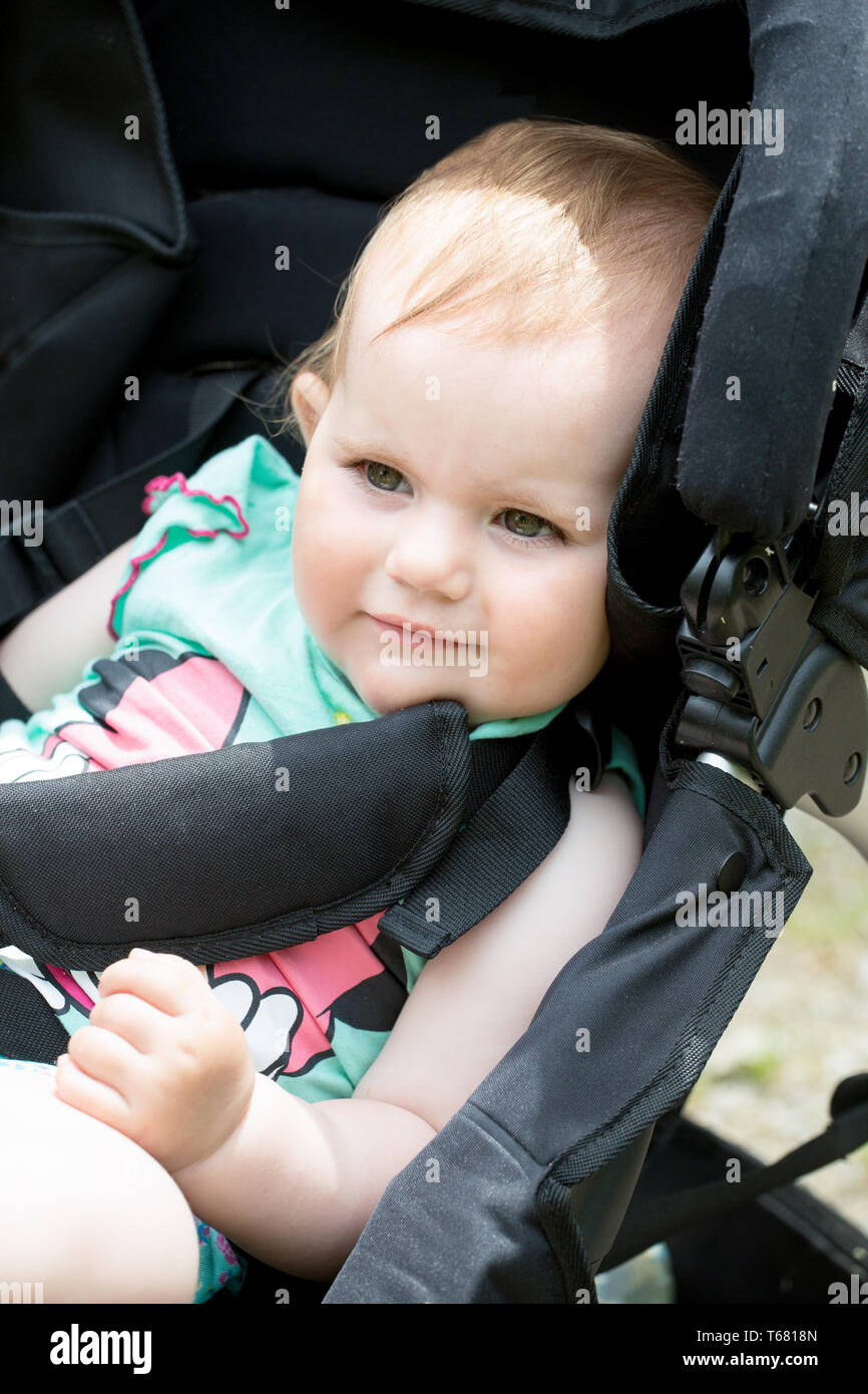Cute White Blond Baby girl on Stroller Stock Photo - Alamy