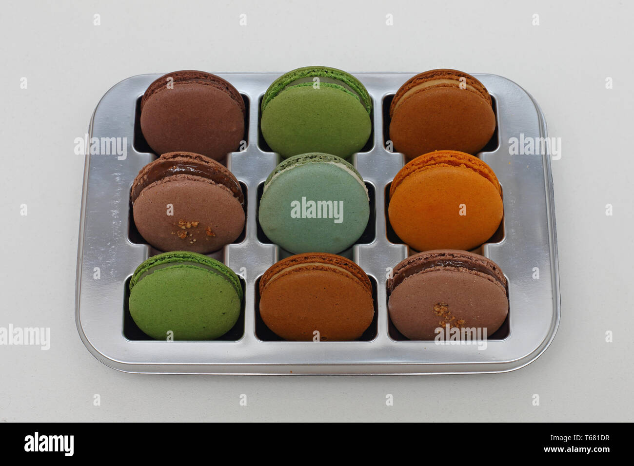 Nine Colourful French Macarons in a Tray Stock Photo - Alamy