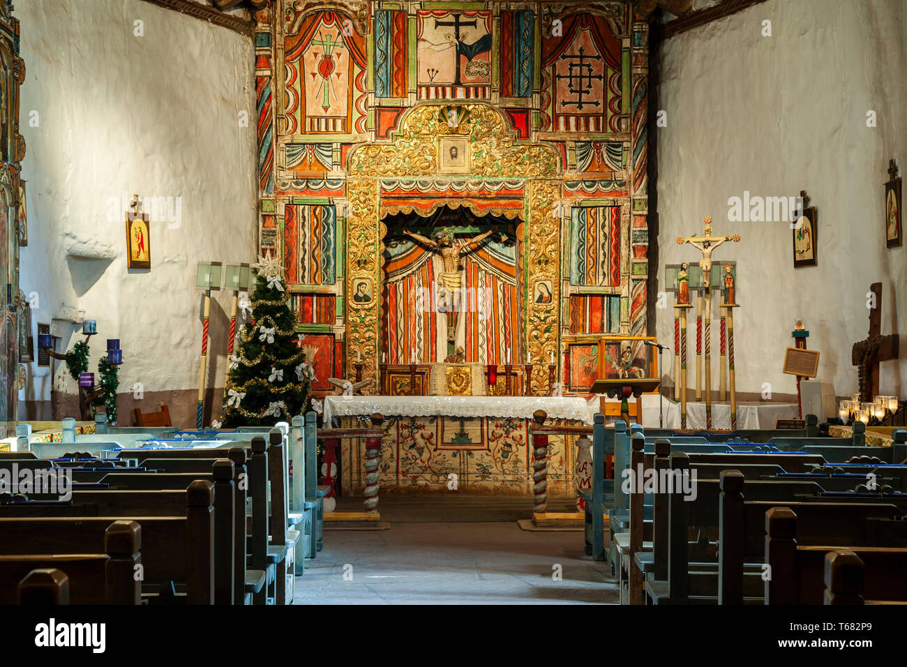 Altar piece (retablo) and pews, Sanutario de Chimayo, Chimayo, New ...