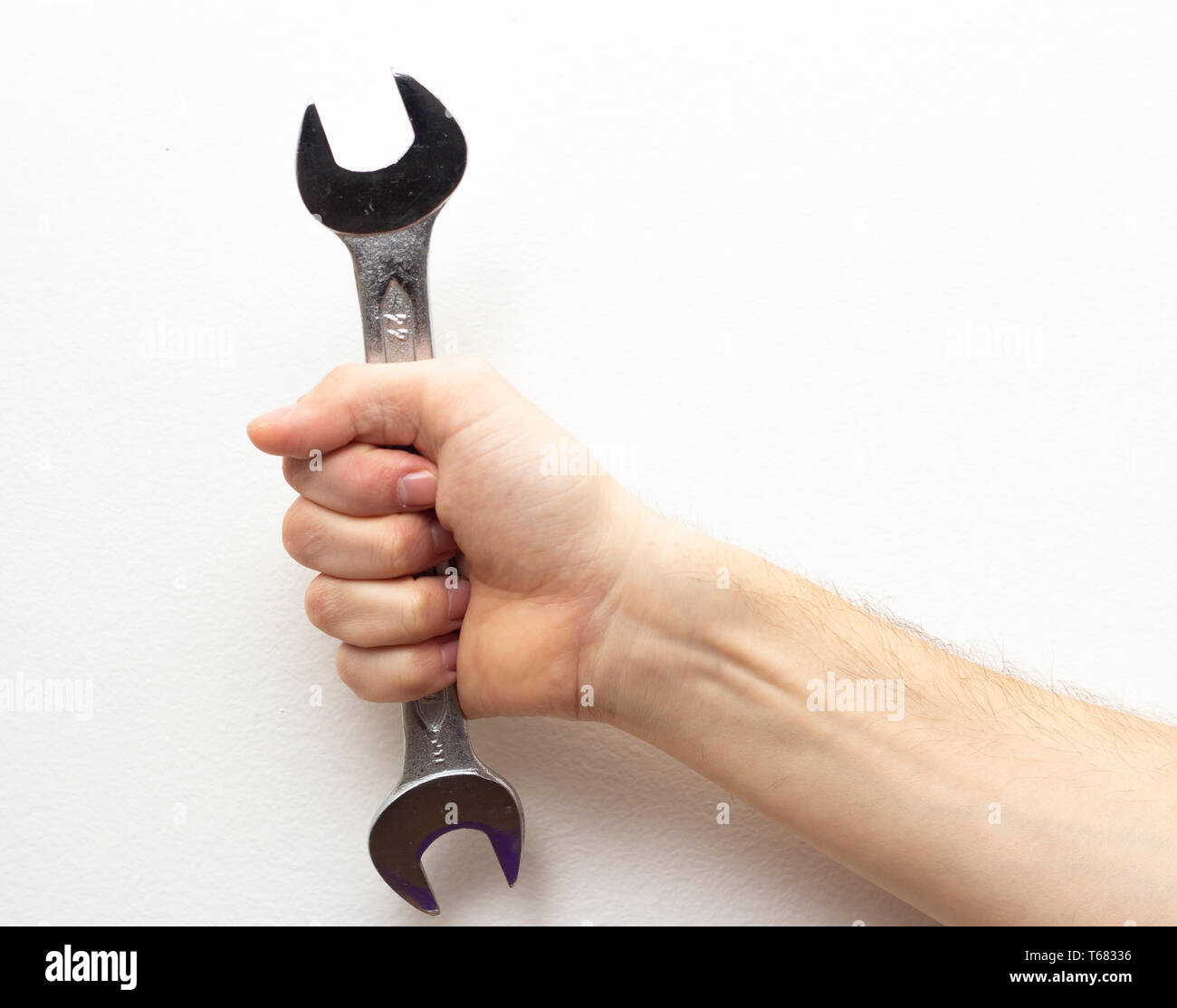 wrench in the hand Stock Photo - Alamy
