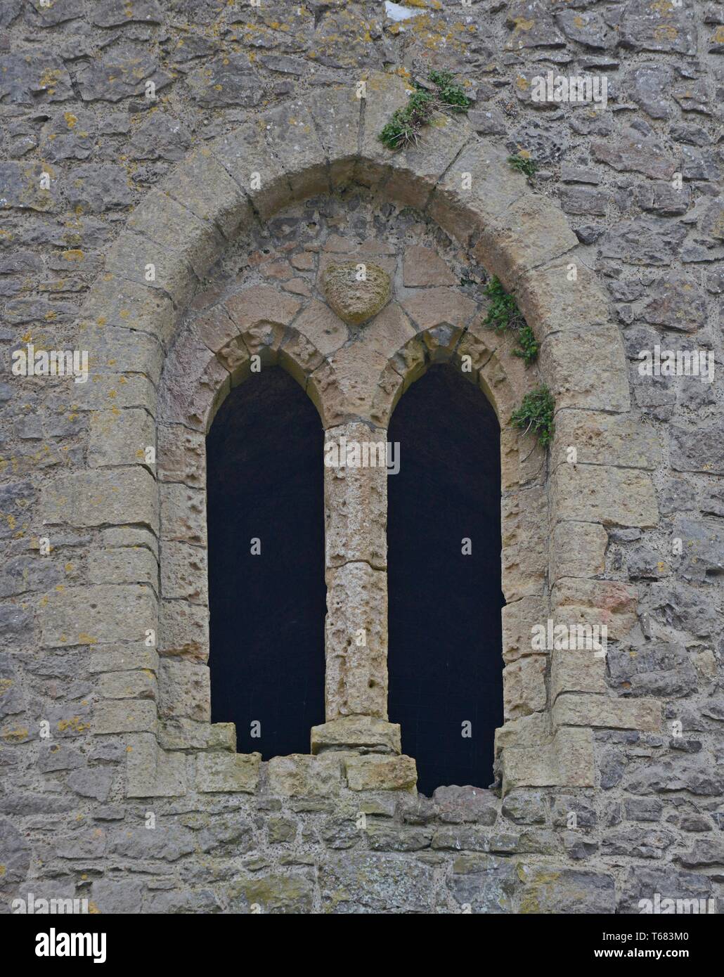 An arched stone window at Pembroke Castle, West Wales Stock Photo - Alamy