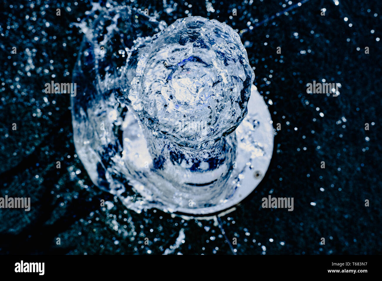 Water jet going up towards the camera, blue tones, background for ...
