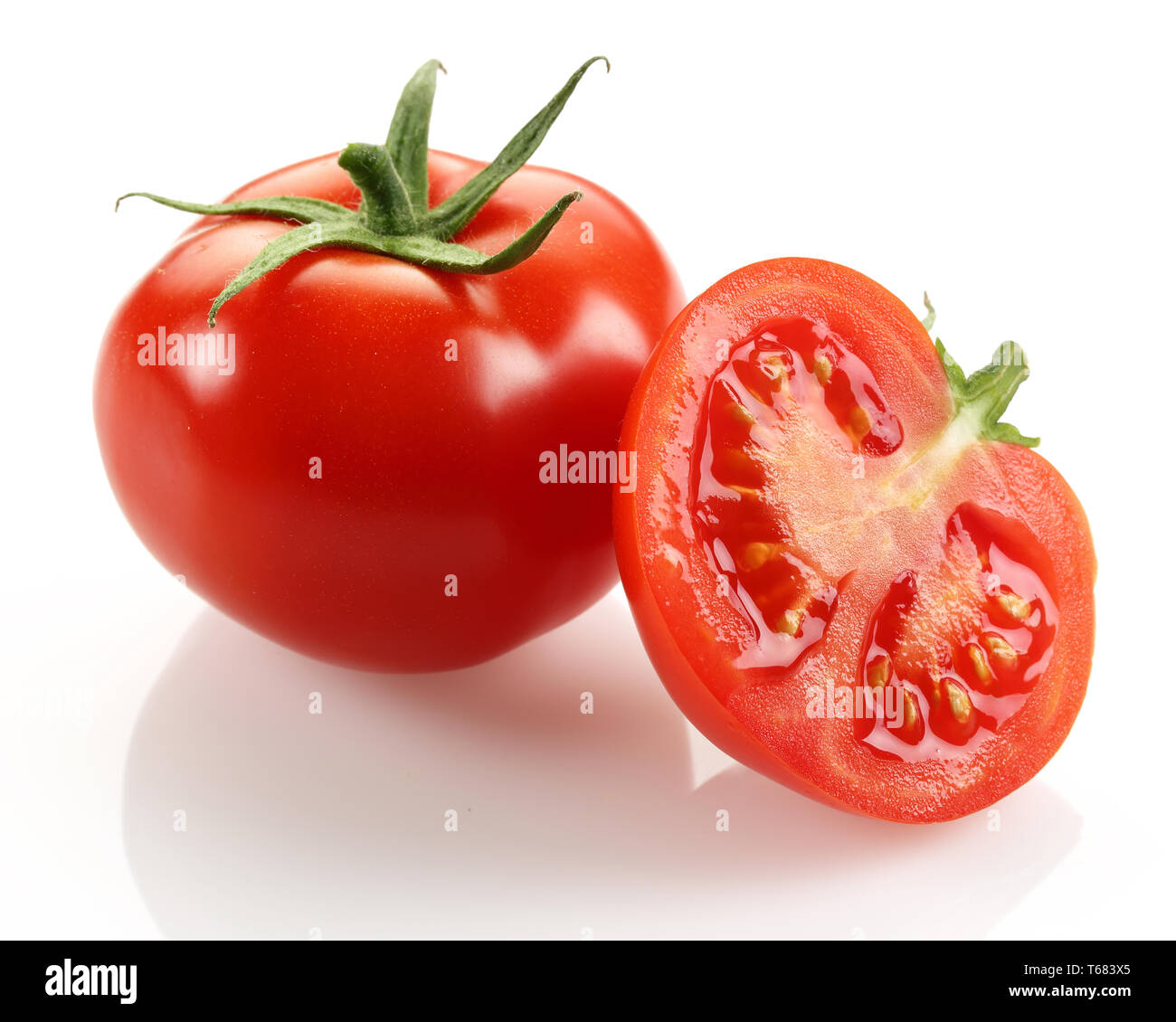 Whole and half tomatoes isolated on white background Stock Photo - Alamy