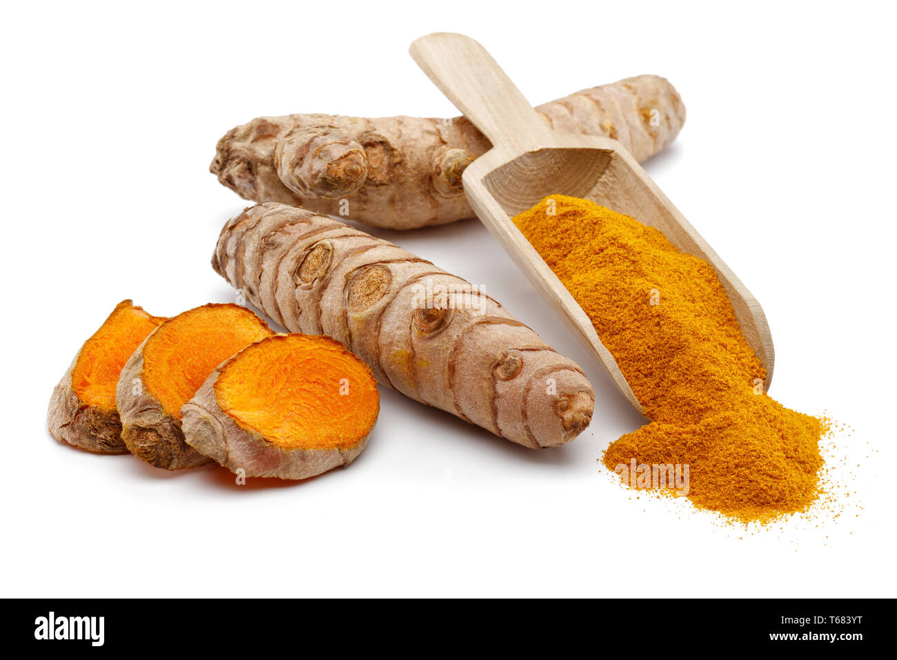 Fresh turmeric with slices and curcuma in wooden spoon isolated on ...
