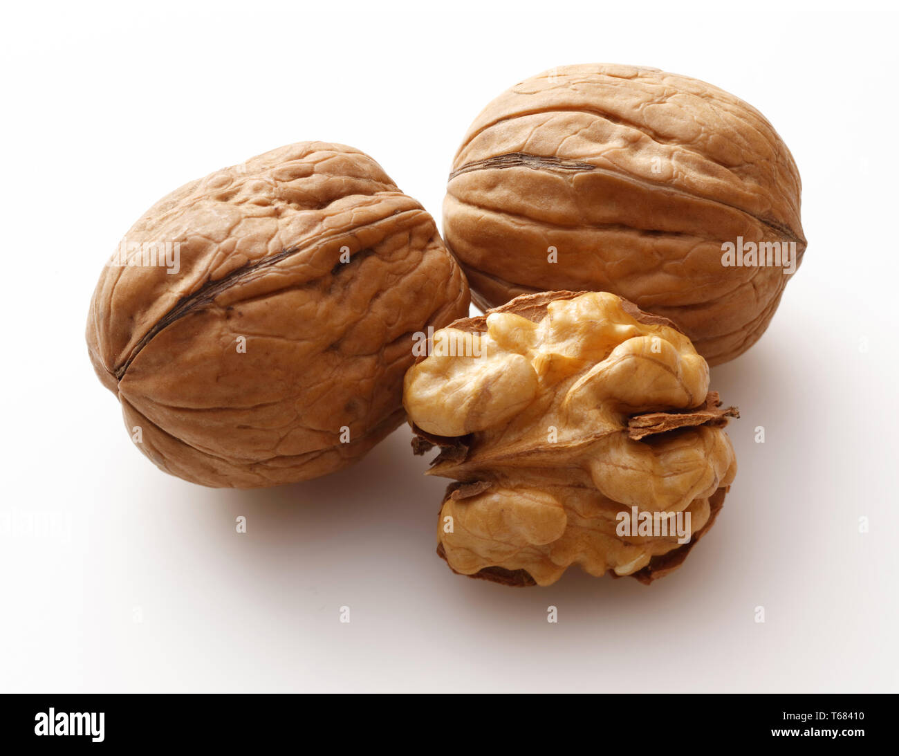 Whole and broken walnuts isolated on white background Stock Photo - Alamy
