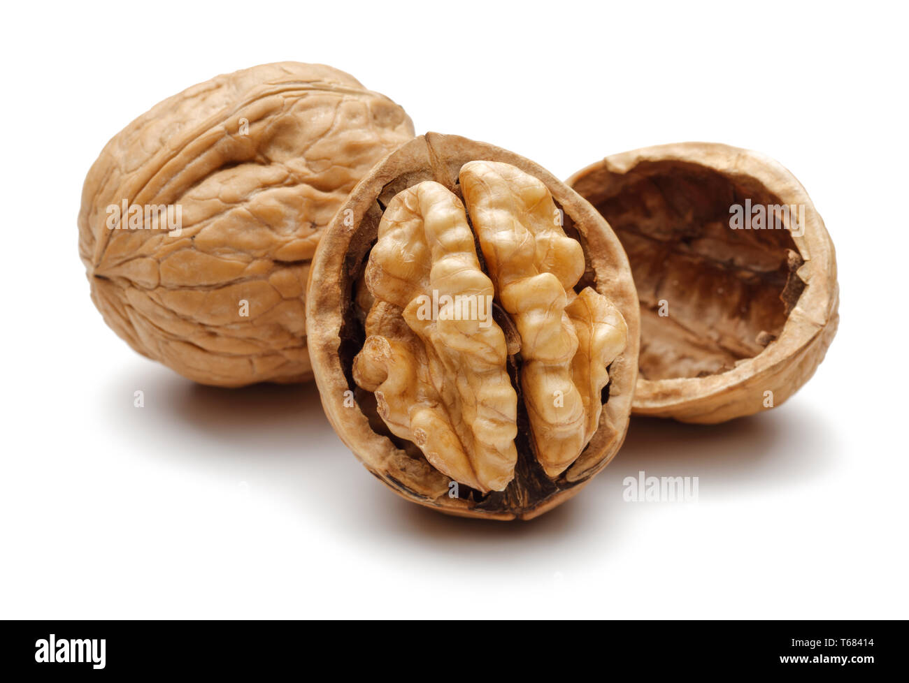 Whole and broken walnuts isolated on white background Stock Photo - Alamy