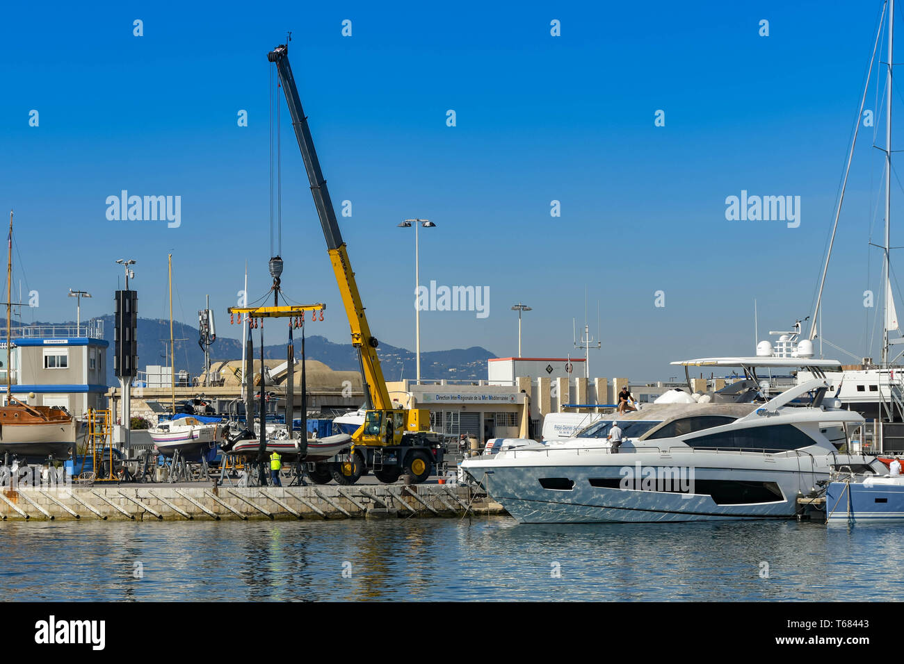 CANNES, FRANCE - APRIL 2019: Mobile crane in the boatyard in Cannes ...