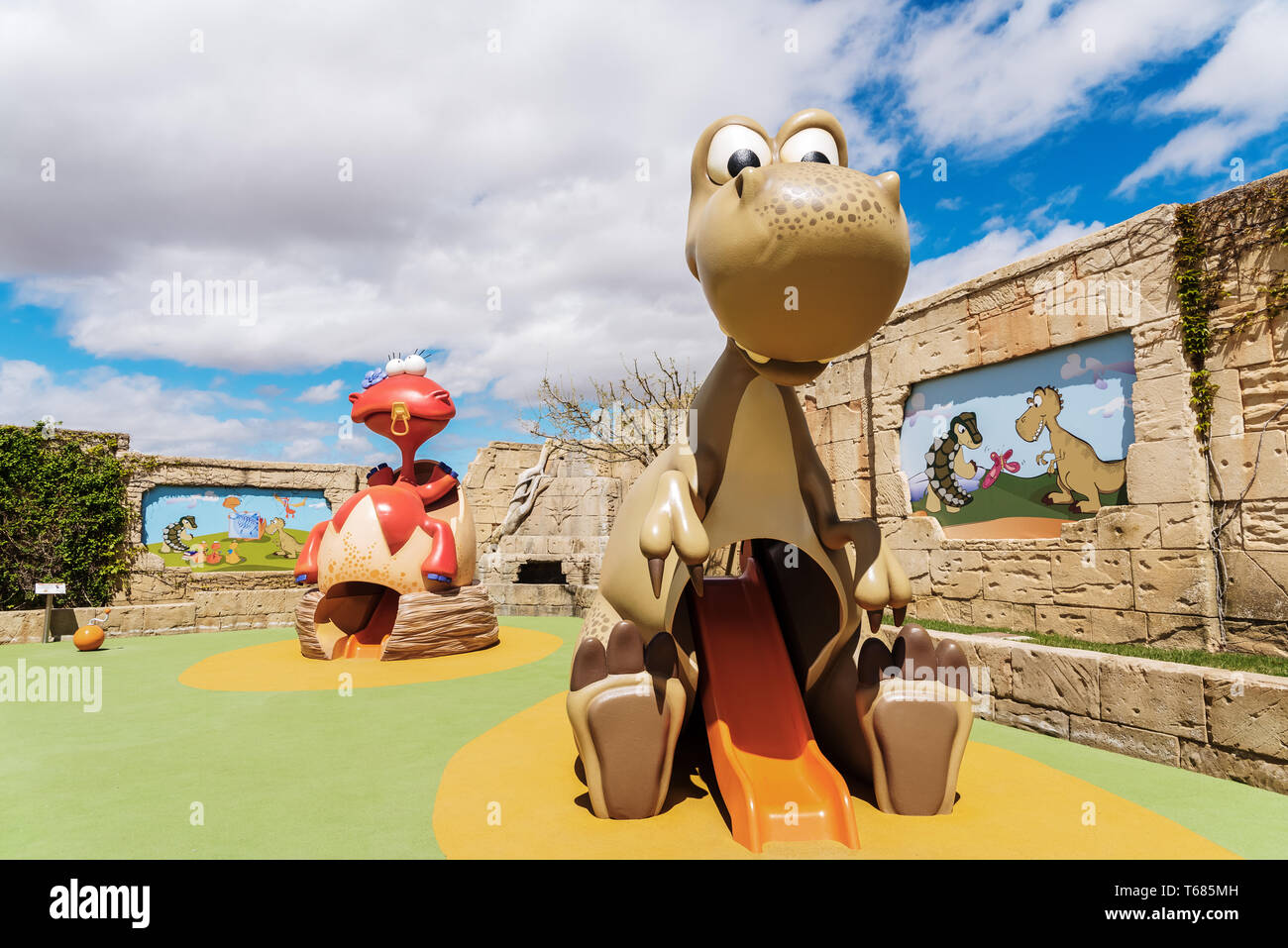Children's playground with slides in the shape of cute dinosaurs Stock ...