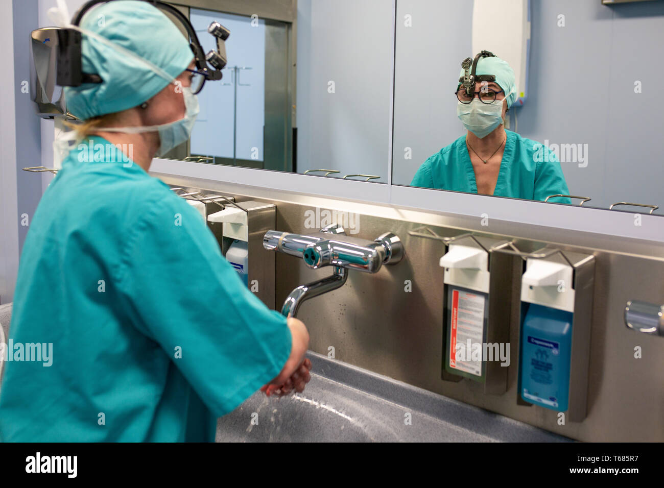Surgeon washing hands before surgery hi-res stock photography and ...