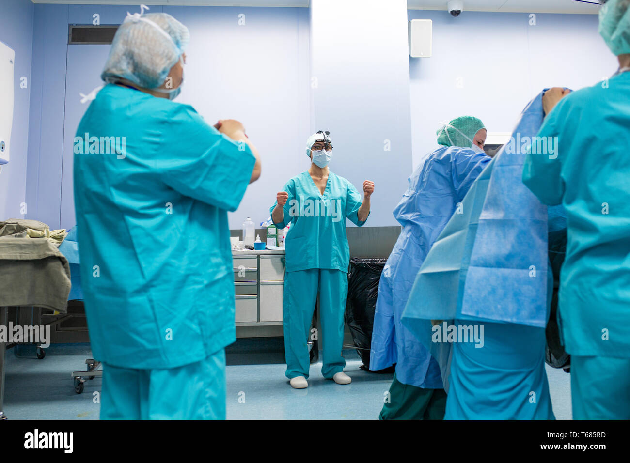 surgery, medicine and people concept - group of surgeons in operating ...