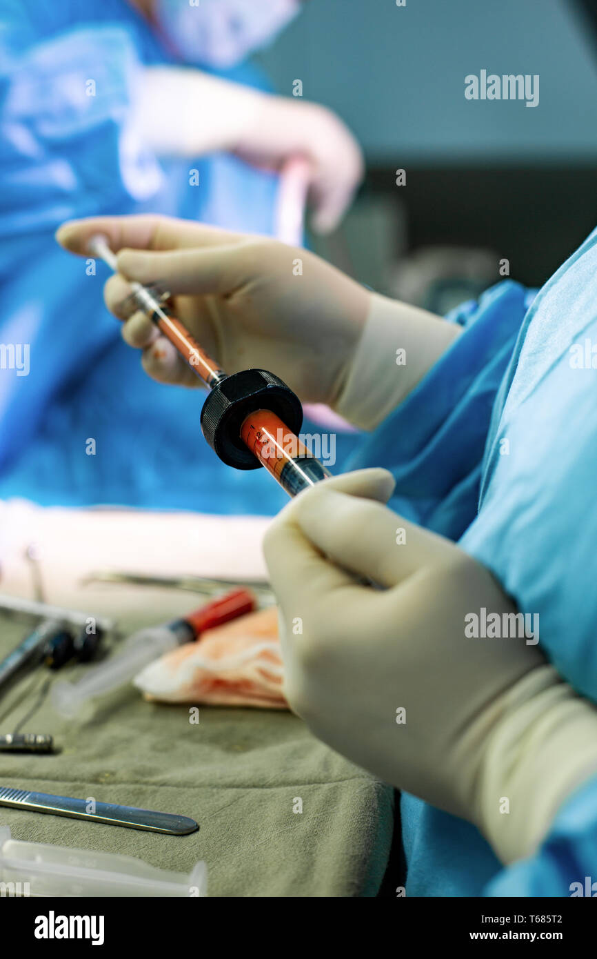 Hands Holding Syringe and Transfer Fat with Nano Fat Transfer Tool in ...