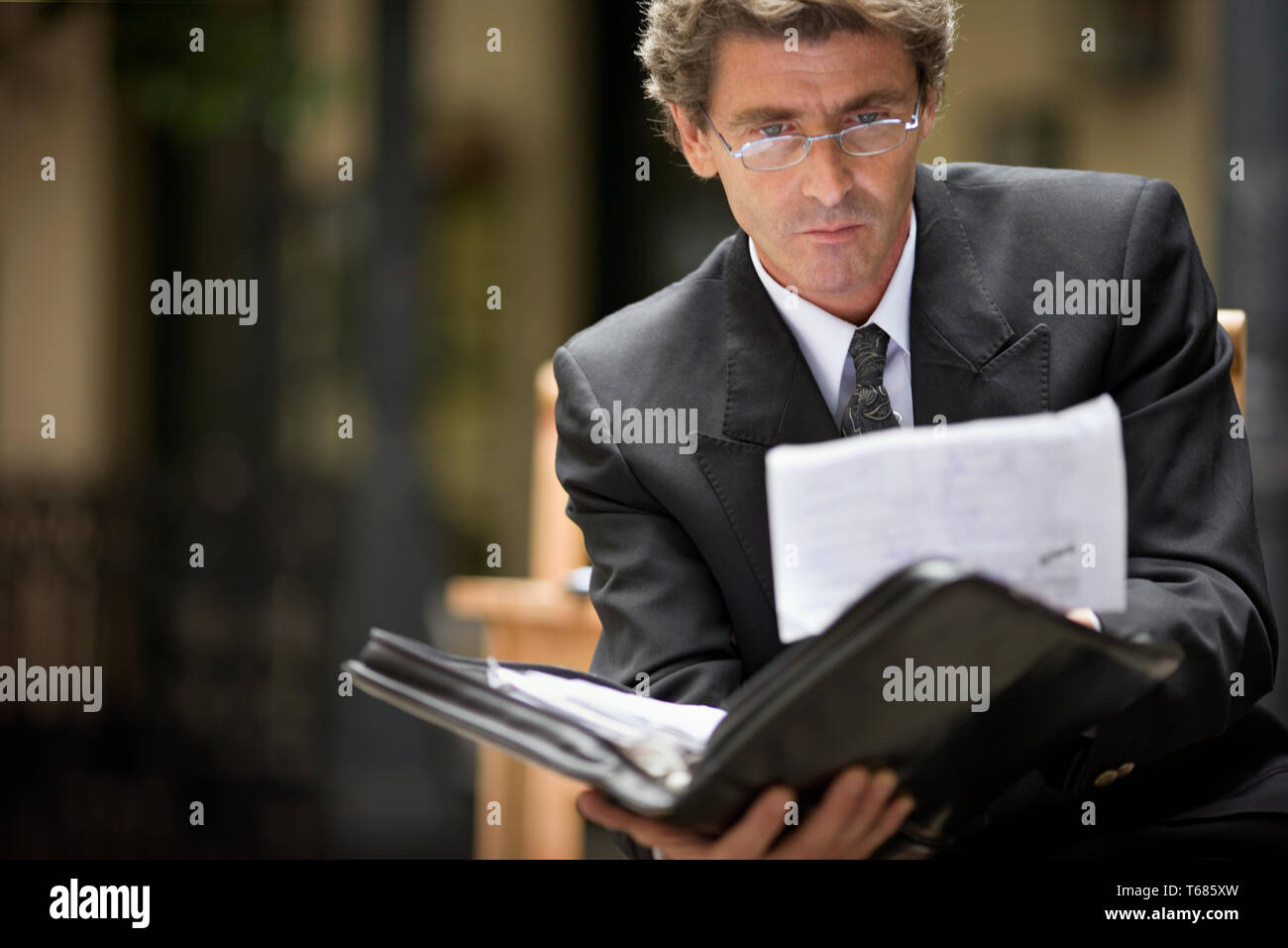 View of a man busy in an official work Stock Photo - Alamy