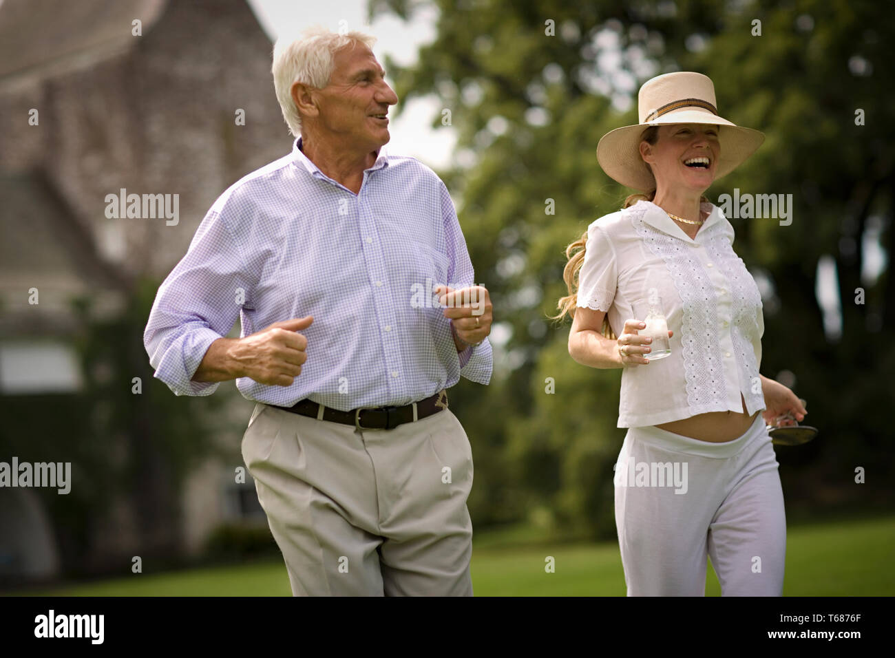View of two people running together Stock Photo - Alamy