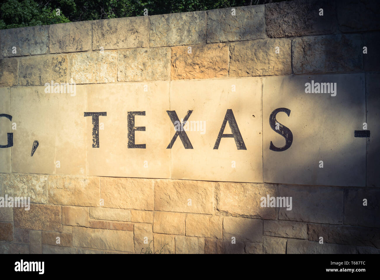 Old stone texture of Texas with a comma word on wall brick Stock Photo ...