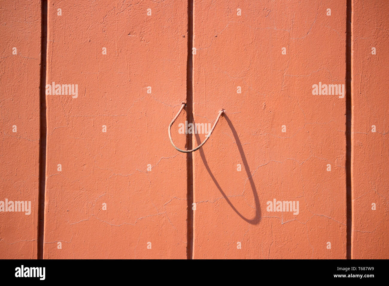 concrete wall with grooves and light brick color sticking out in the ...