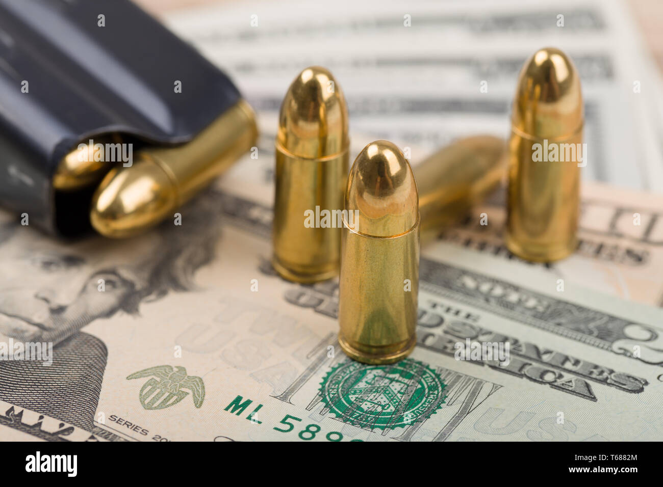 bullet on US dollar banknotes Stock Photo - Alamy