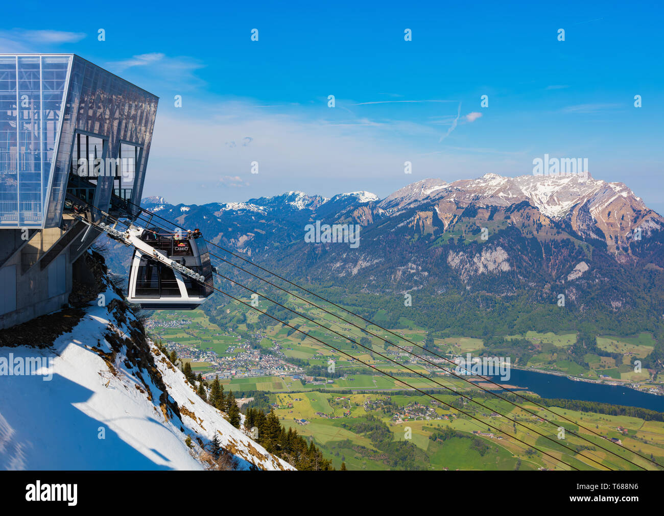A gondola of the Stanserhorn Cabrio overhead cable car at the station ...