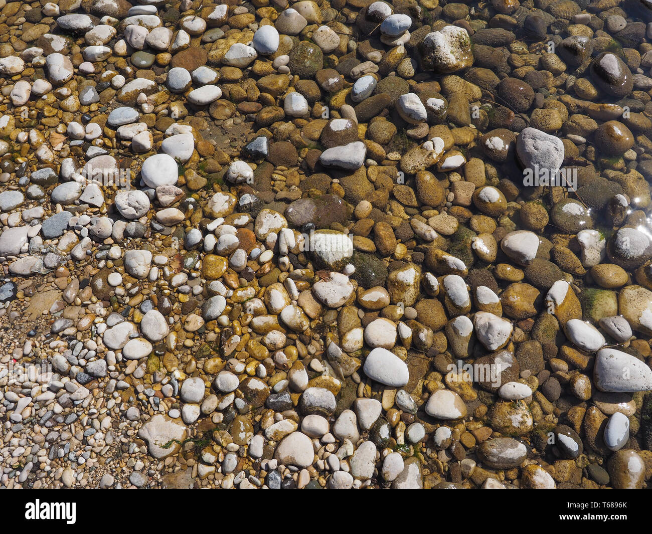 cobble and water texture useful as a background Stock Photo - Alamy