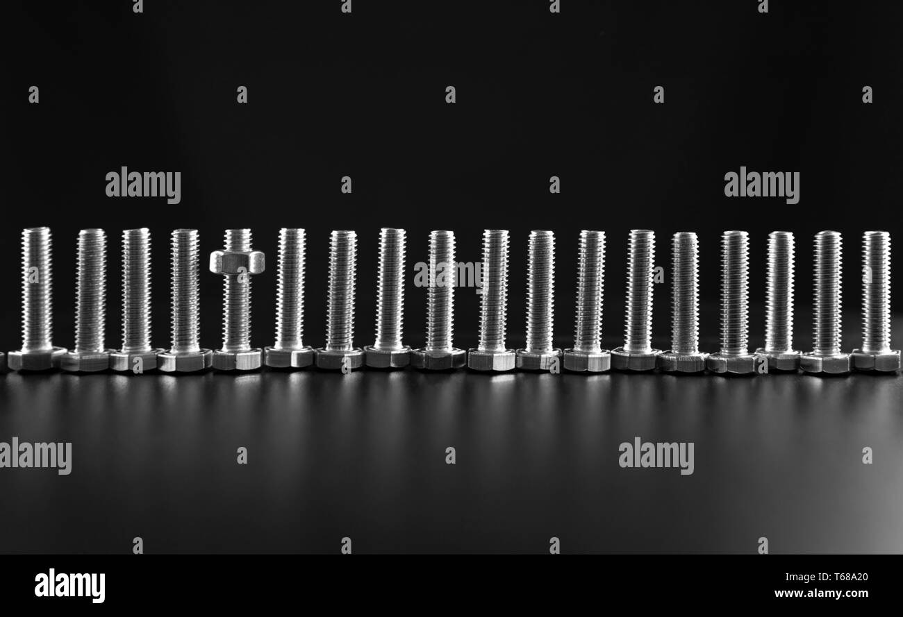 Stack of shiny bolt on a black background Stock Photo - Alamy