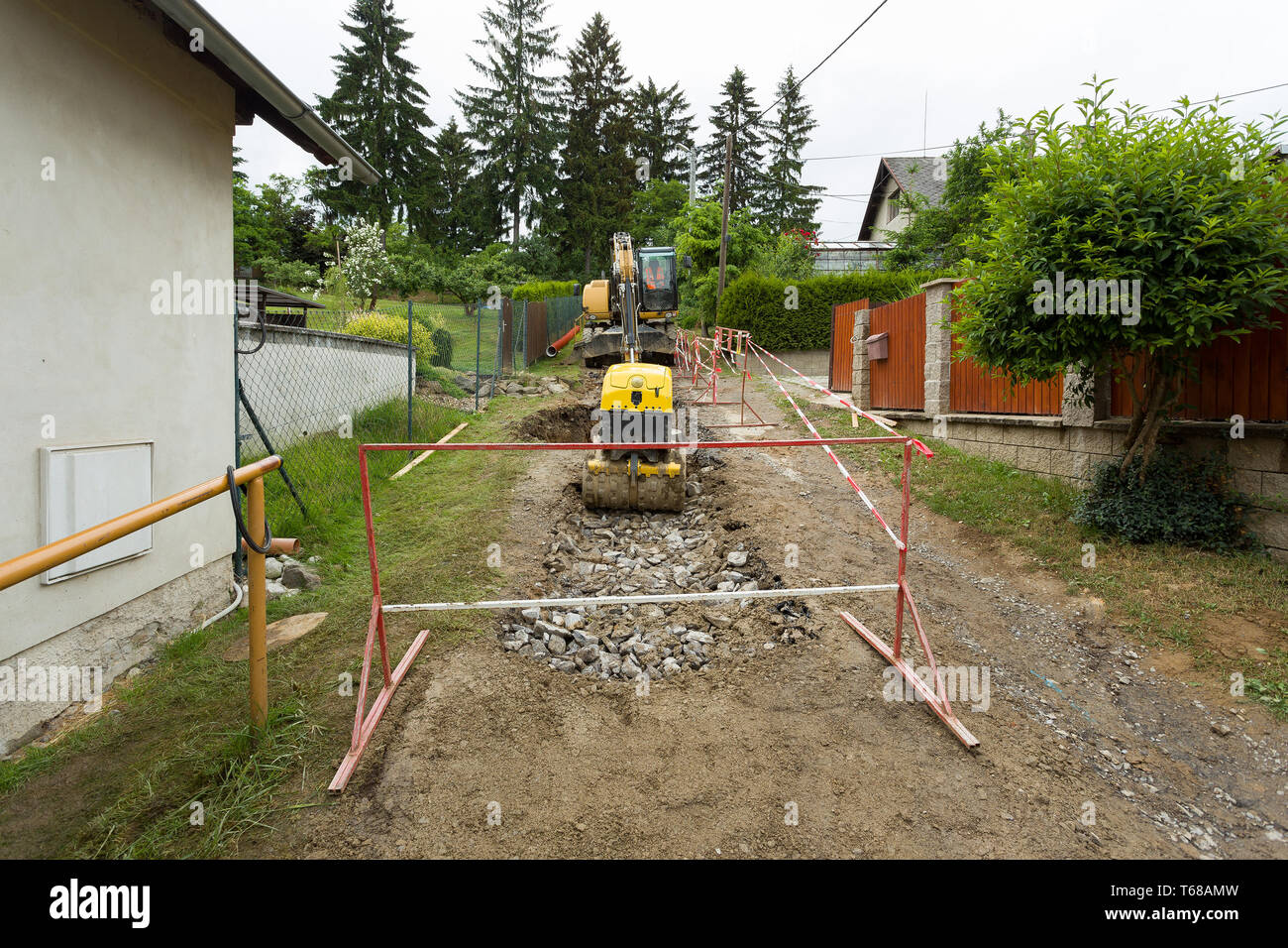 excavator on trench - constructing canalization Stock Photo - Alamy