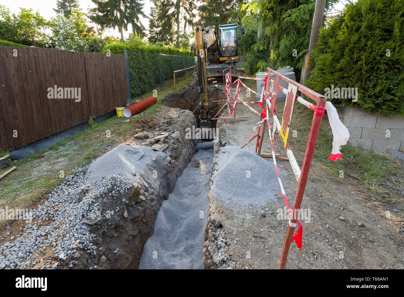 excavator on trench - constructing canalization Stock Photo - Alamy